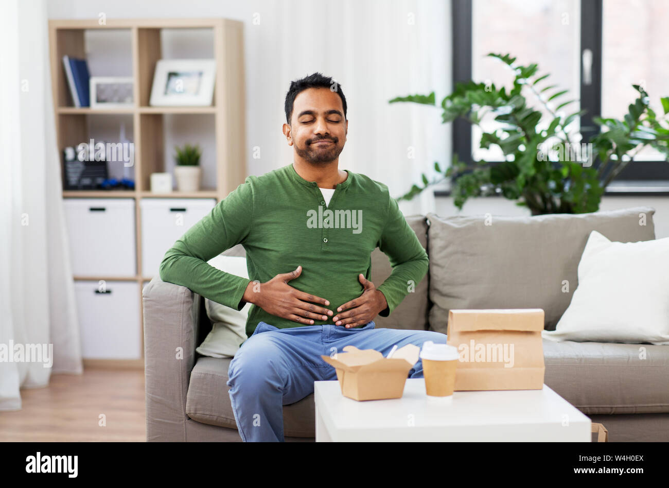 Indian man eating hi-res stock photography and images - Alamy