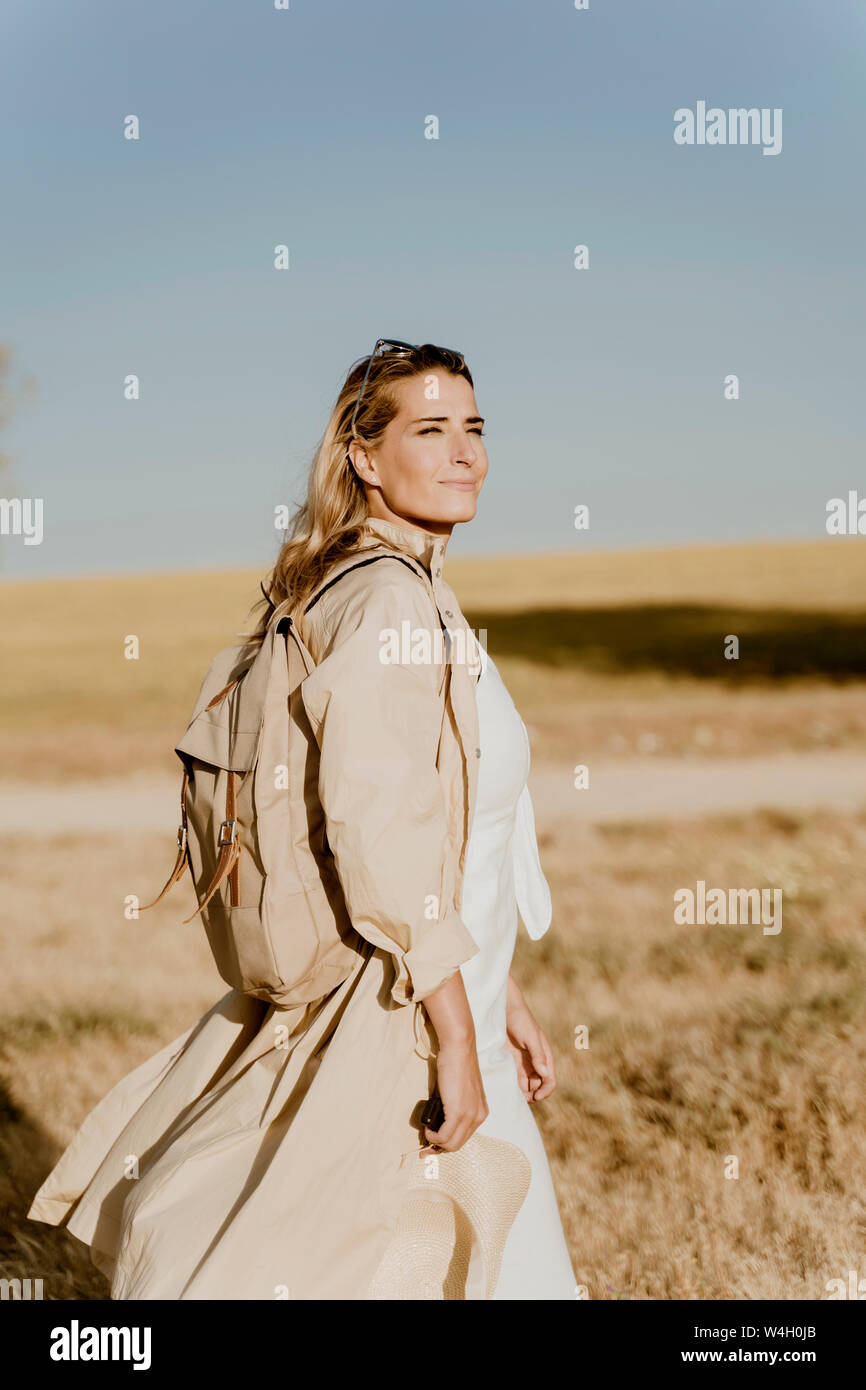 Female traveller looking sideways Stock Photo - Alamy