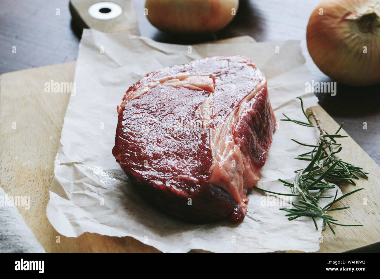 Cooking, meat preparation. Raw steak on the table Stock Photo - Alamy