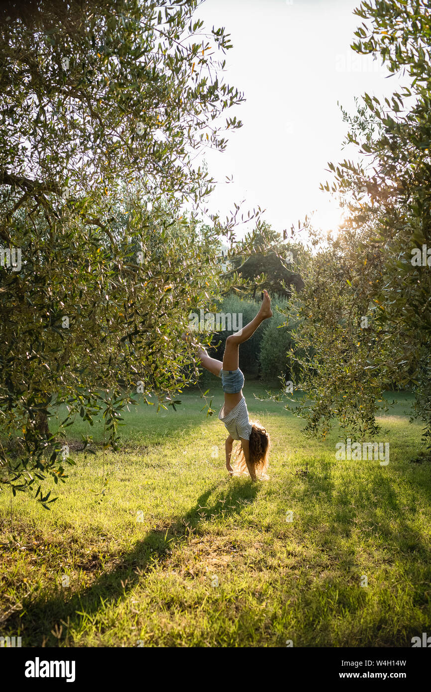 Girl doing a handstand hi-res stock photography and images - Alamy