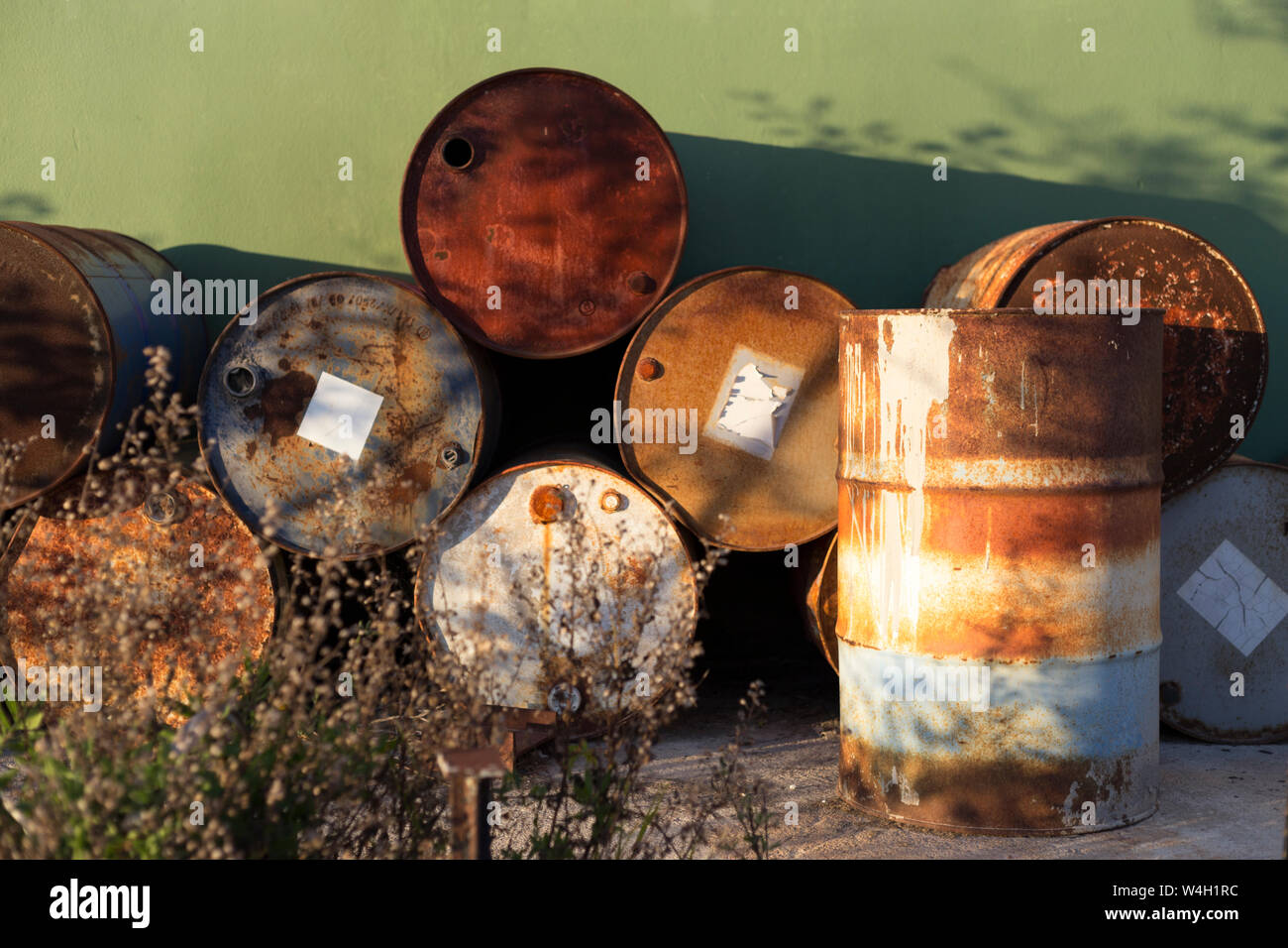 Rusty barrels in a scrapyard Stock Photo - Alamy
