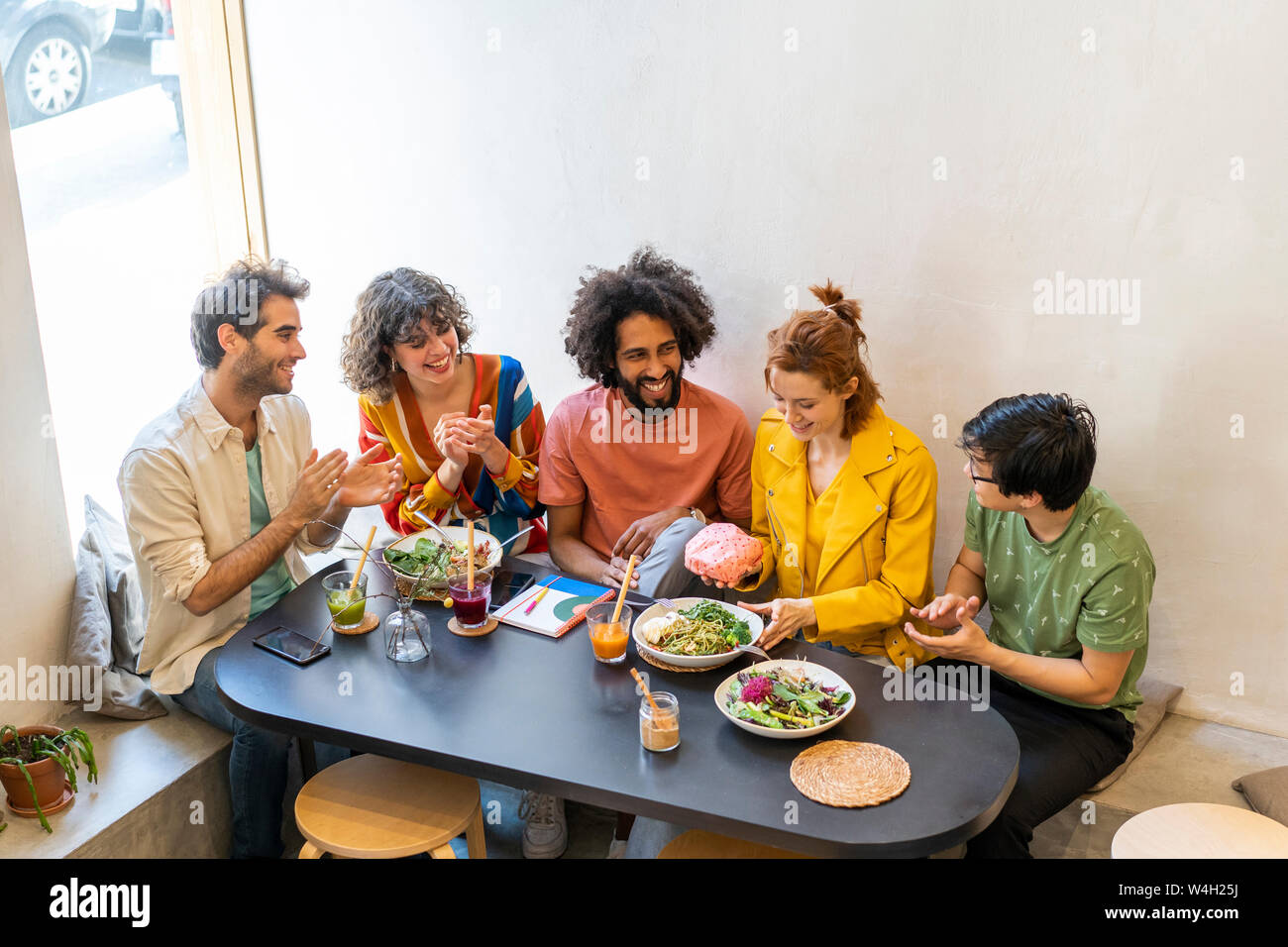 Group of friends having lunch in a restaurant Stock Photo - Alamy