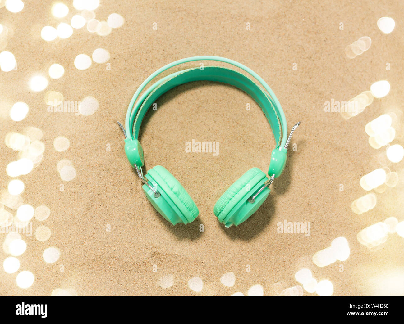 earphones on summer beach sand Stock Photo - Alamy
