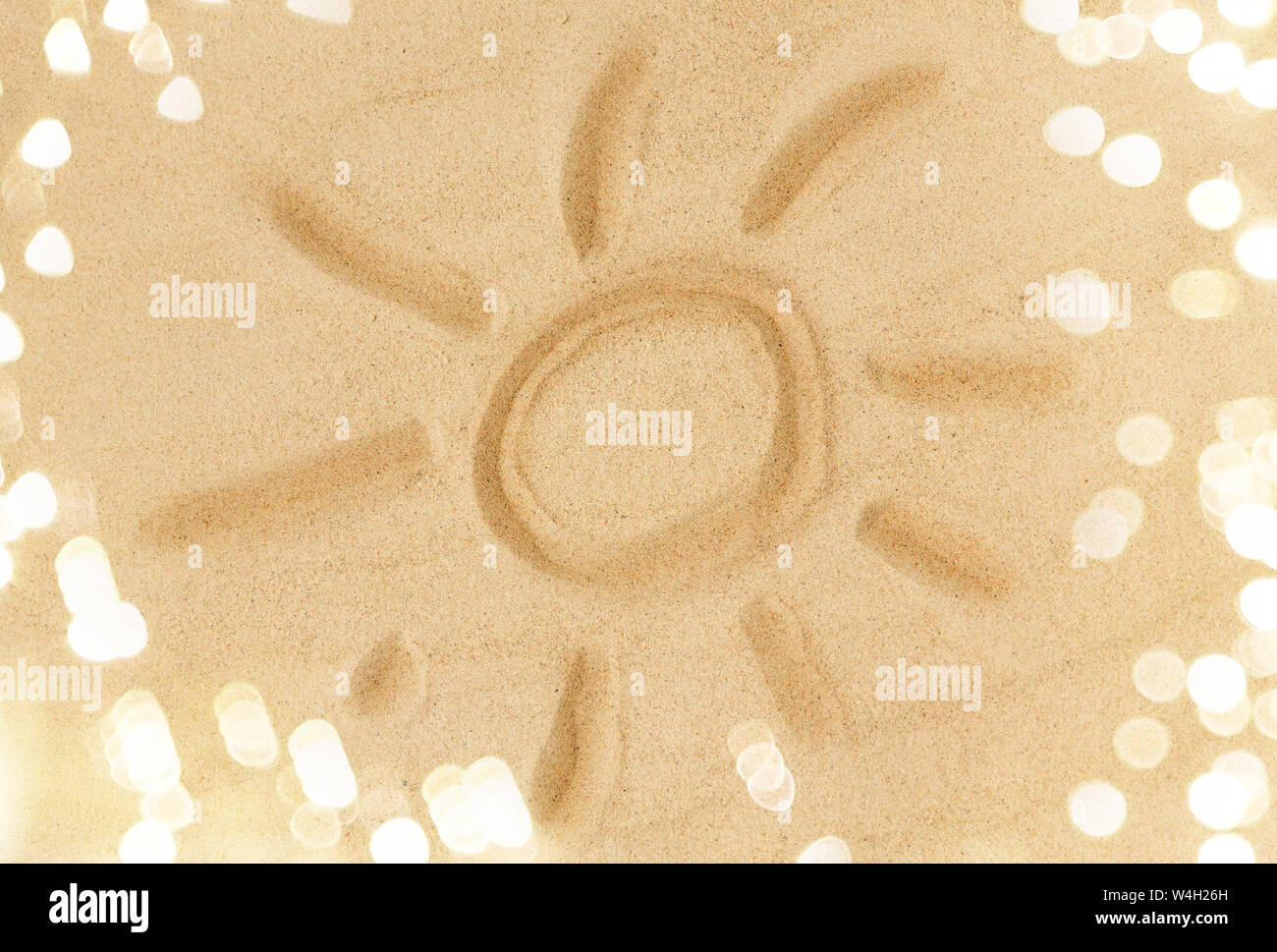 picture of sun in sand on summer beach Stock Photo - Alamy