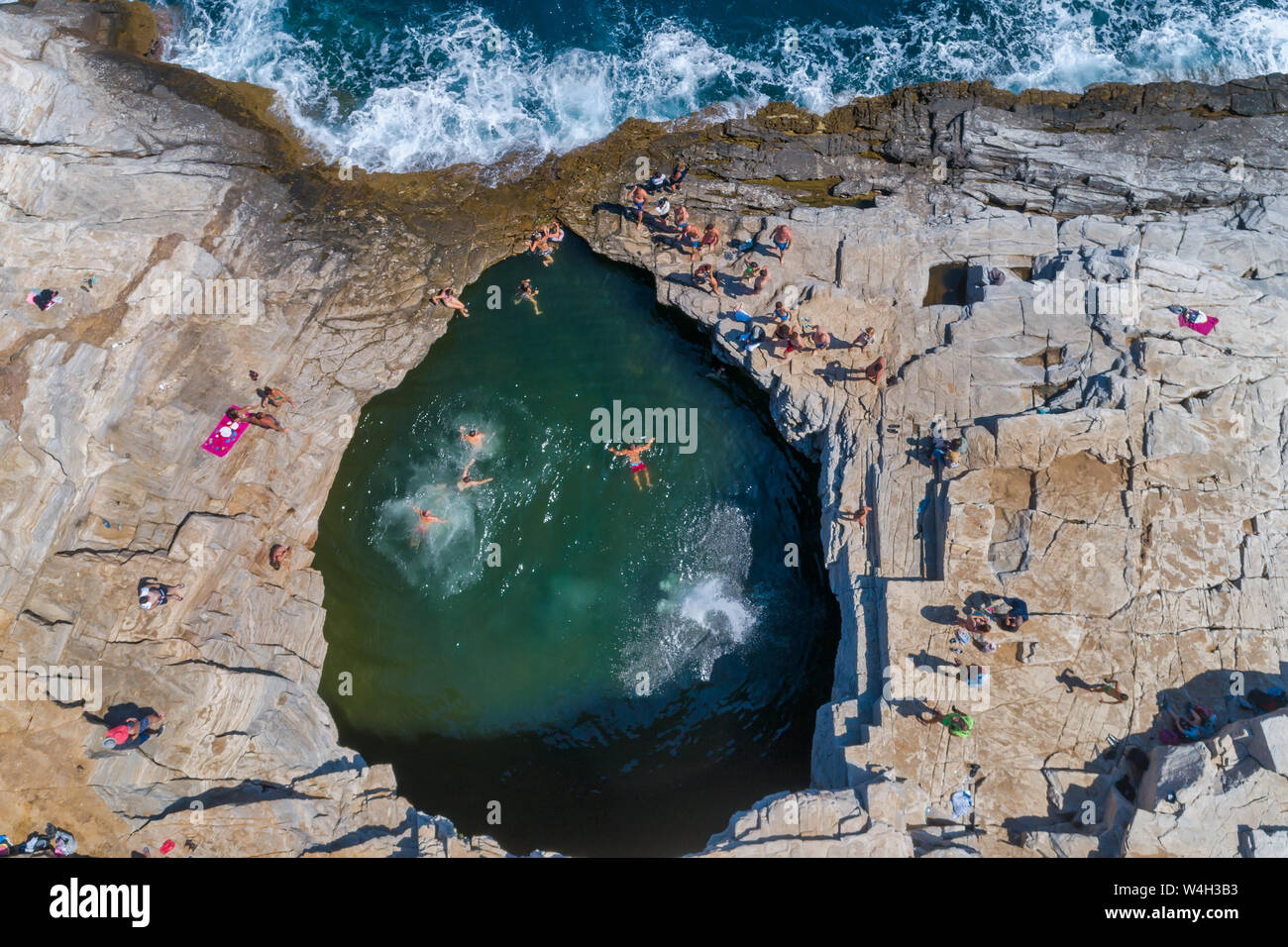 Aerial view of Tourists bathing in the Giola. Giola is a natural pool ...