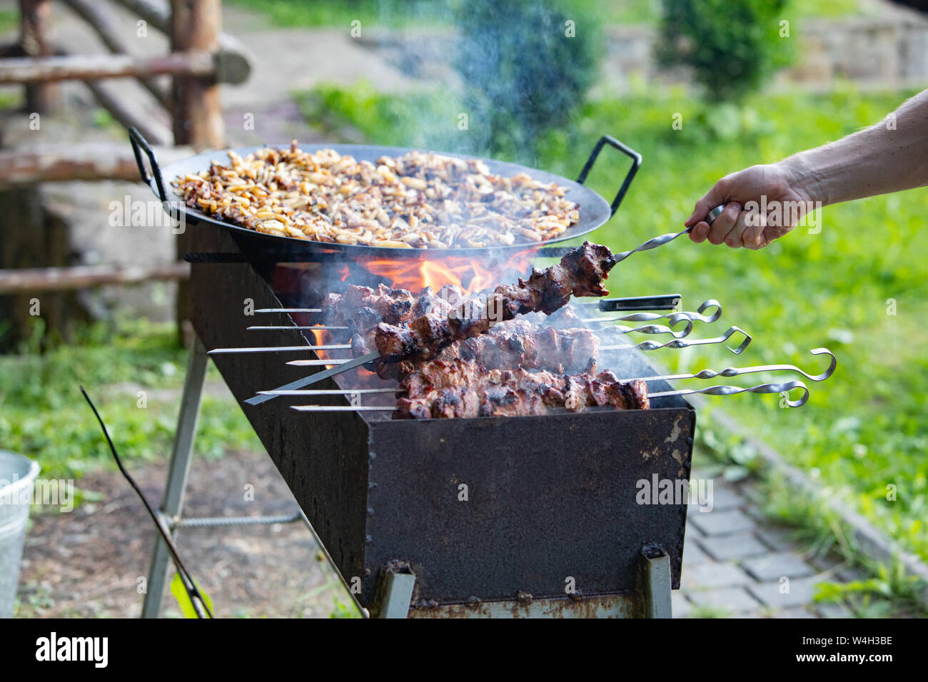cooking meat at bbq fire close up Stock Photo - Alamy