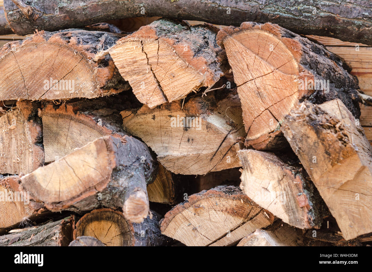 Pile of stacked triangle firewood prepared for fireplace and boiler ...