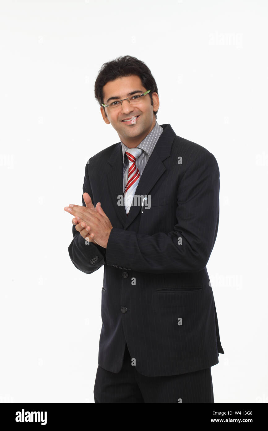 Businessman clapping and smiling Stock Photo - Alamy
