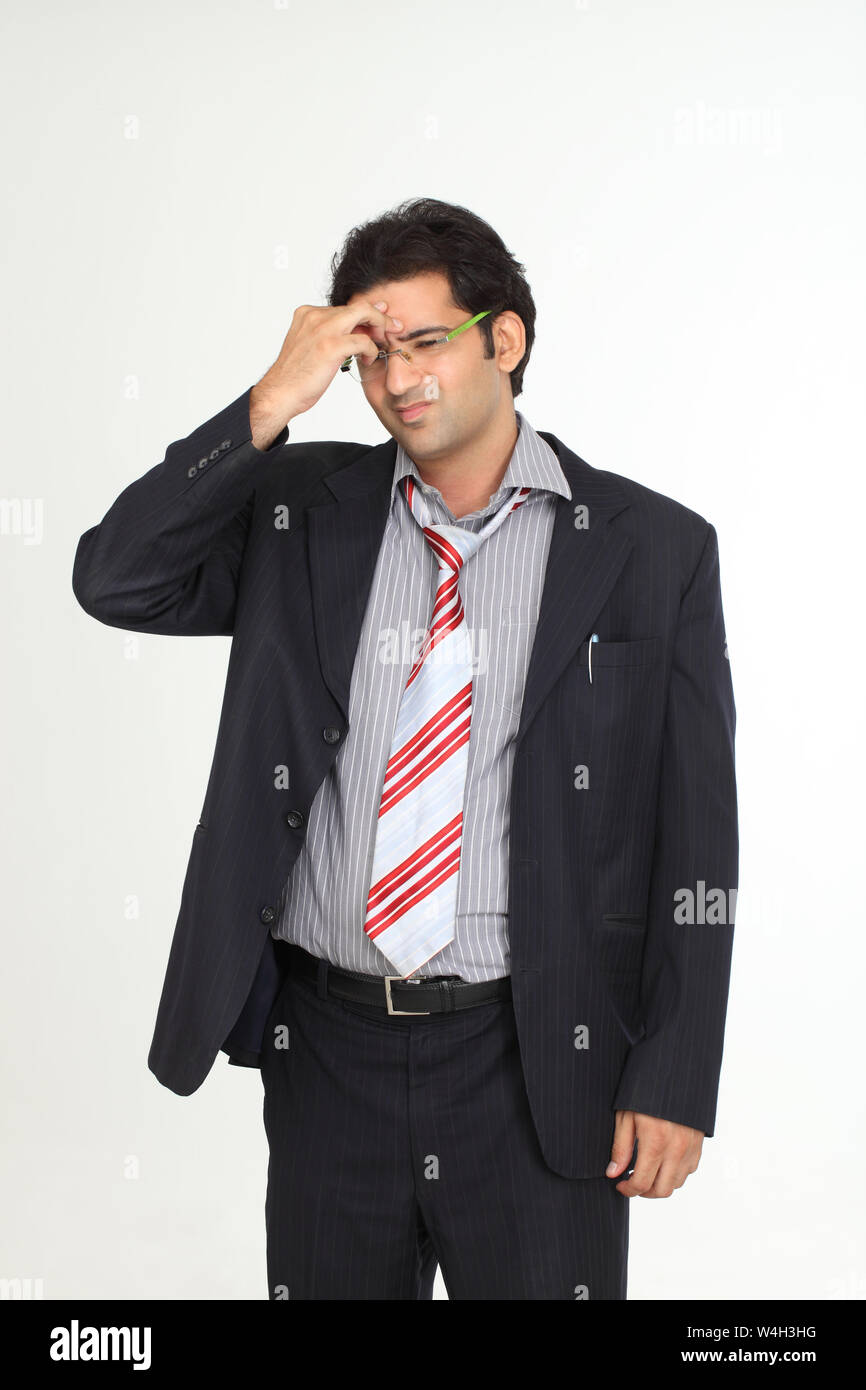 Businessman suffering from headache Stock Photo - Alamy