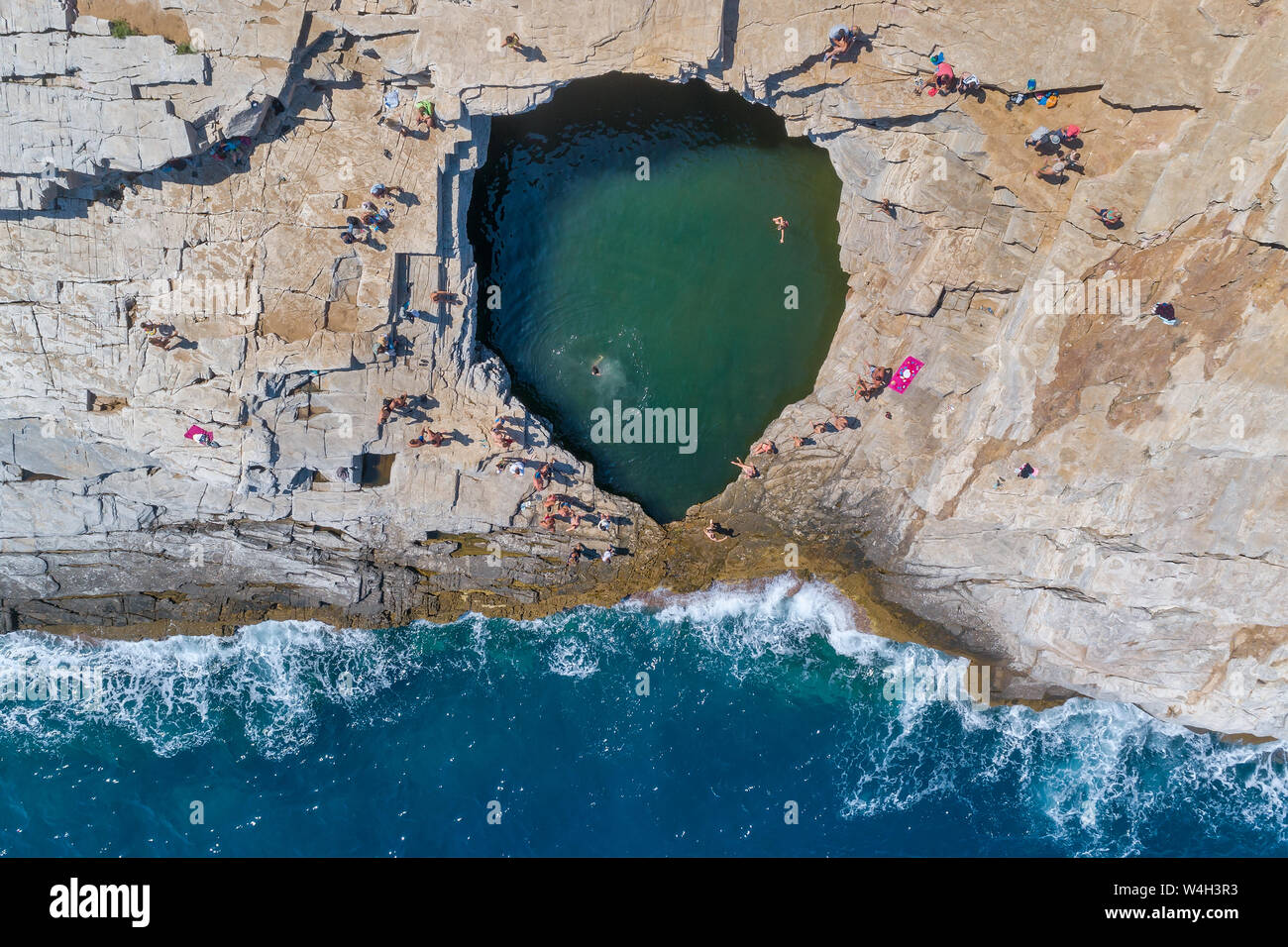 Aerial view of Tourists bathing in the Giola. Giola is a natural pool ...