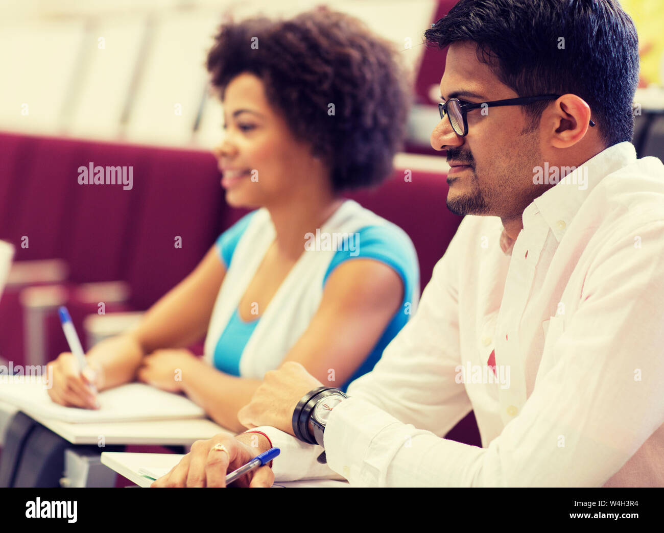 international students with notebooks on lecture Stock Photo - Alamy