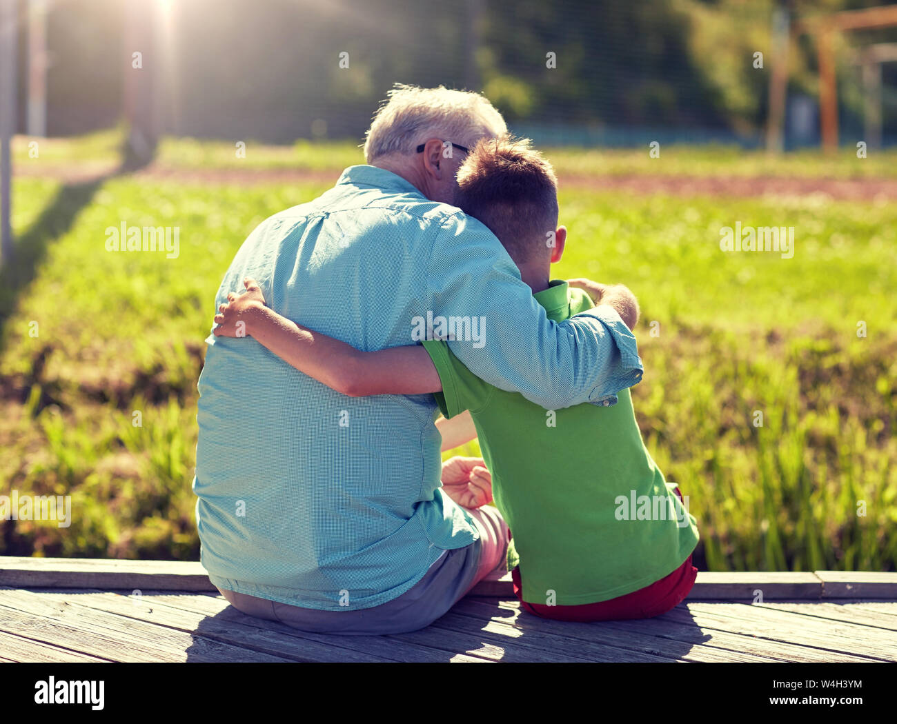 grandfather and grandson hugging on berth Stock Photo - Alamy