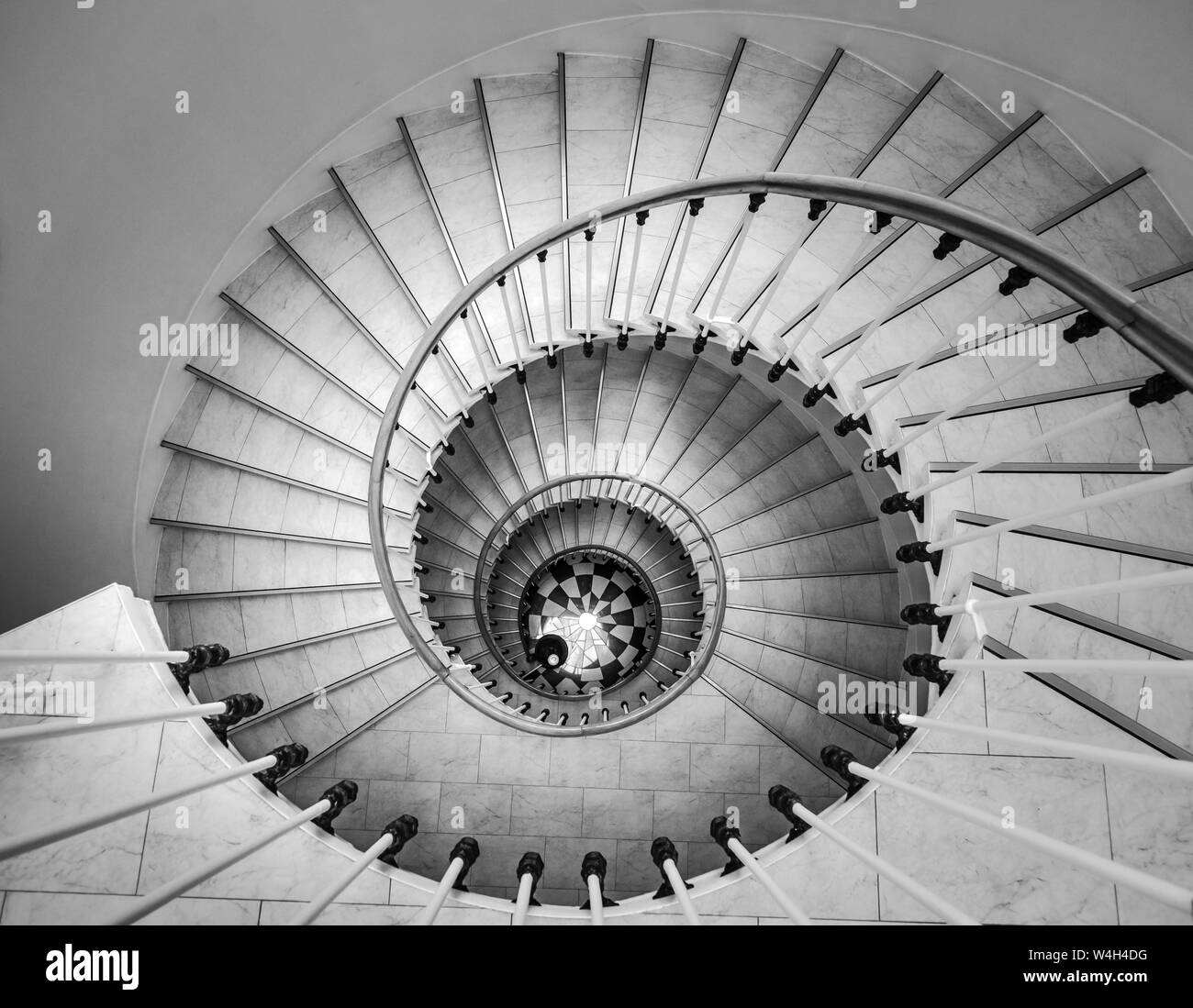 Beautiful circular staircase in old house, snail geometry, black and ...