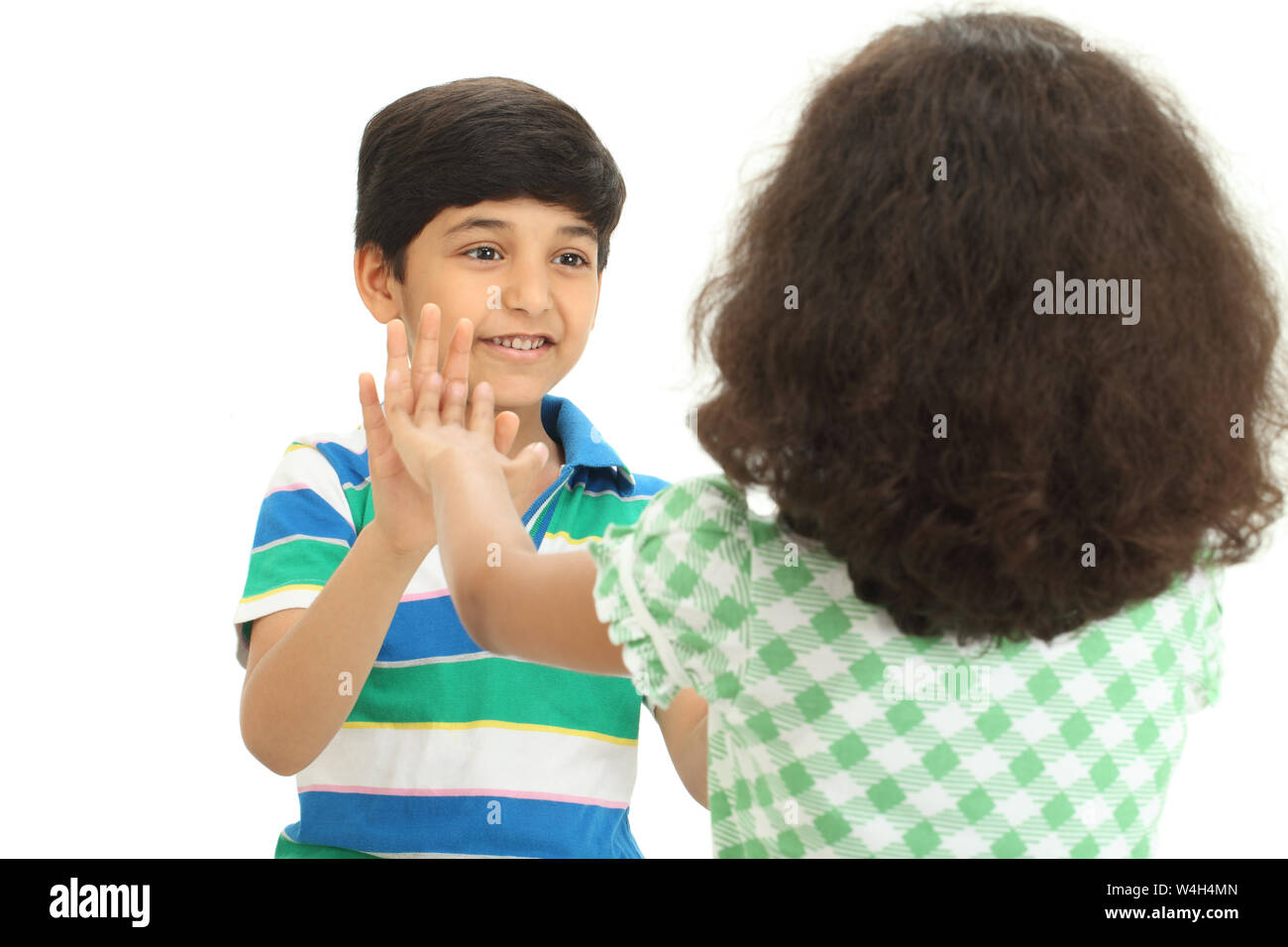 Two Indian children playing a clapping game Stock Photo - Alamy