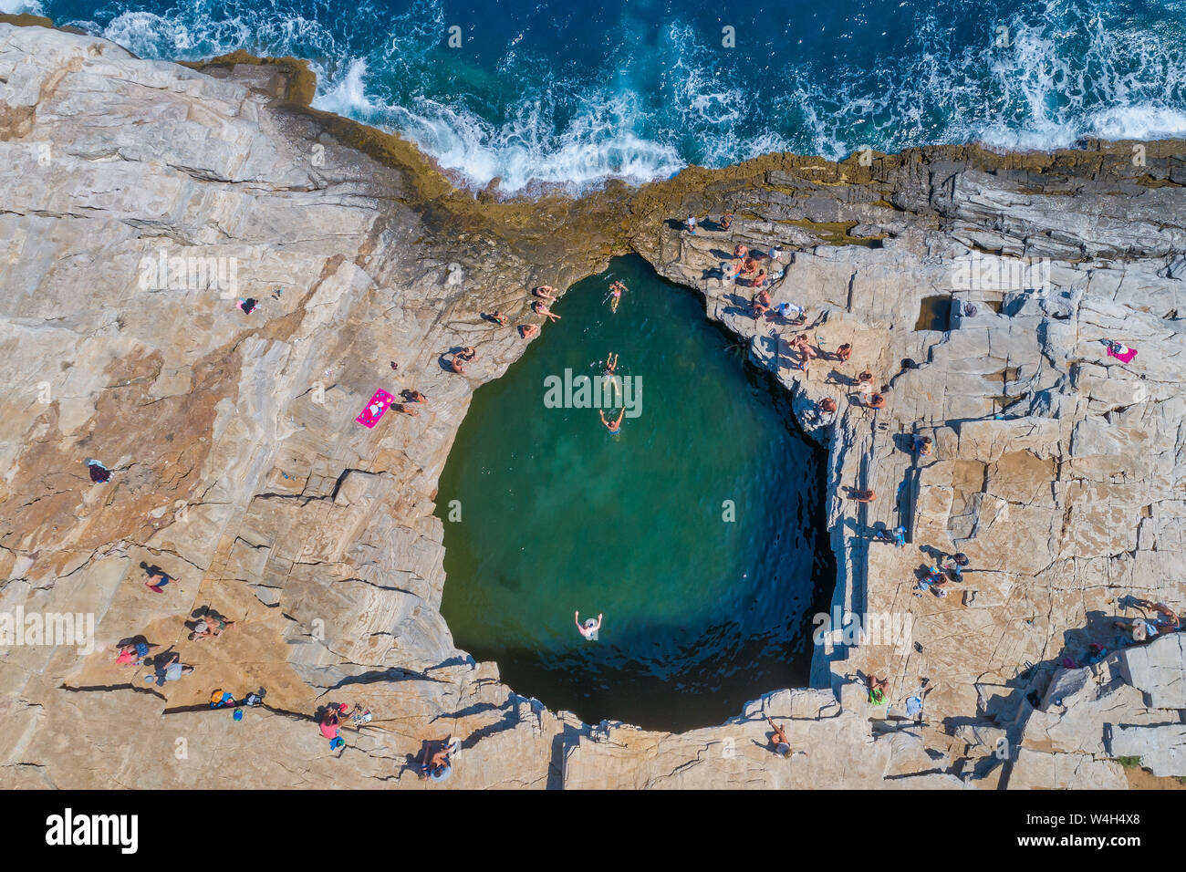 Aerial view of Tourists bathing in the Giola. Giola is a natural pool ...