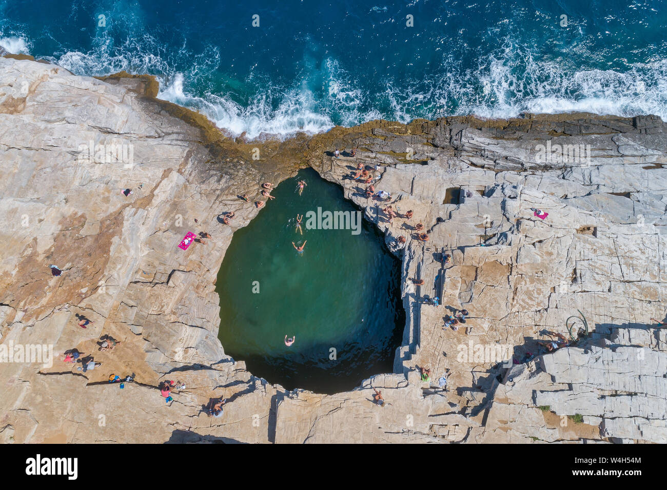 Aerial view of Tourists bathing in the Giola. Giola is a natural pool ...