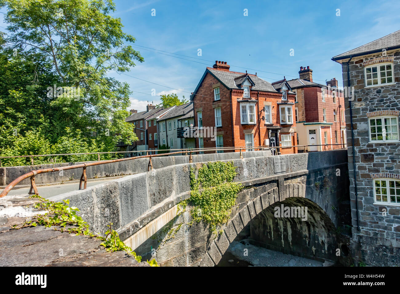Concrete bridge over the River Severn in the quaint town of Llanidloes ...