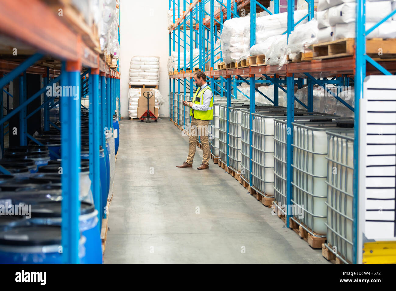 Worker standing in warehouse hi-res stock photography and images - Alamy