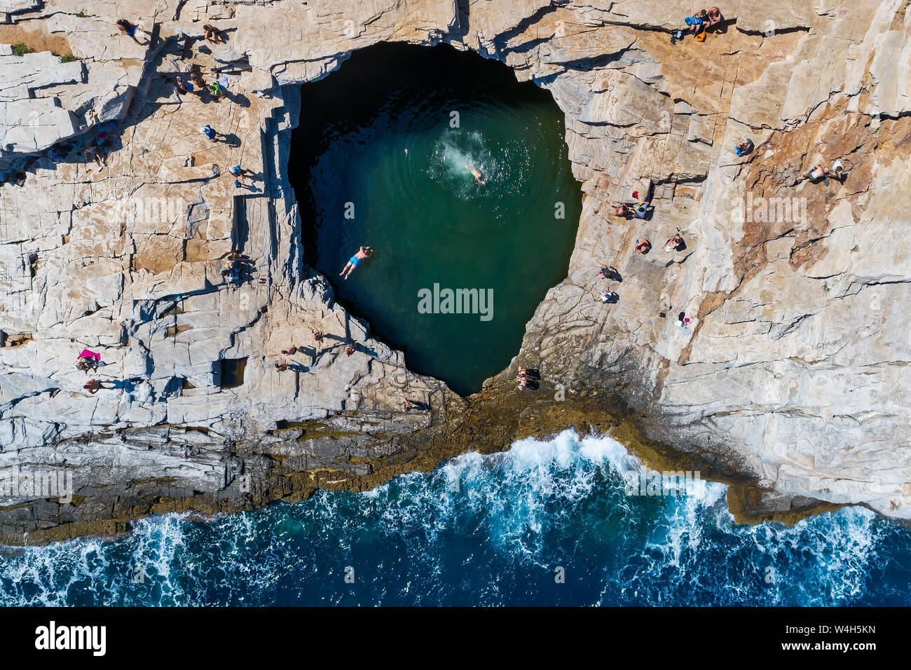 Aerial view of Tourists bathing in the Giola. Giola is a natural pool ...