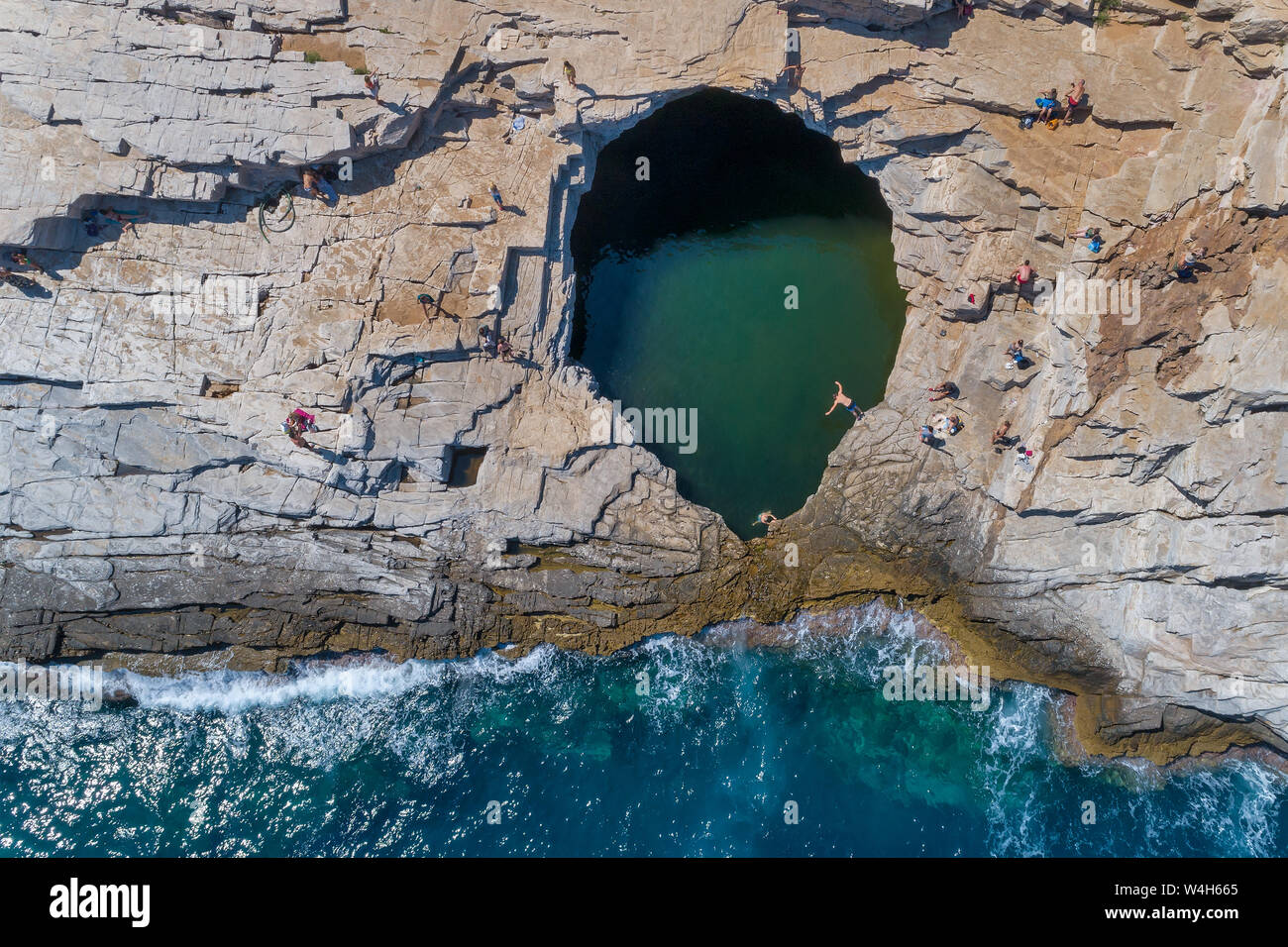 Aerial view of Tourists bathing in the Giola. Giola is a natural pool ...
