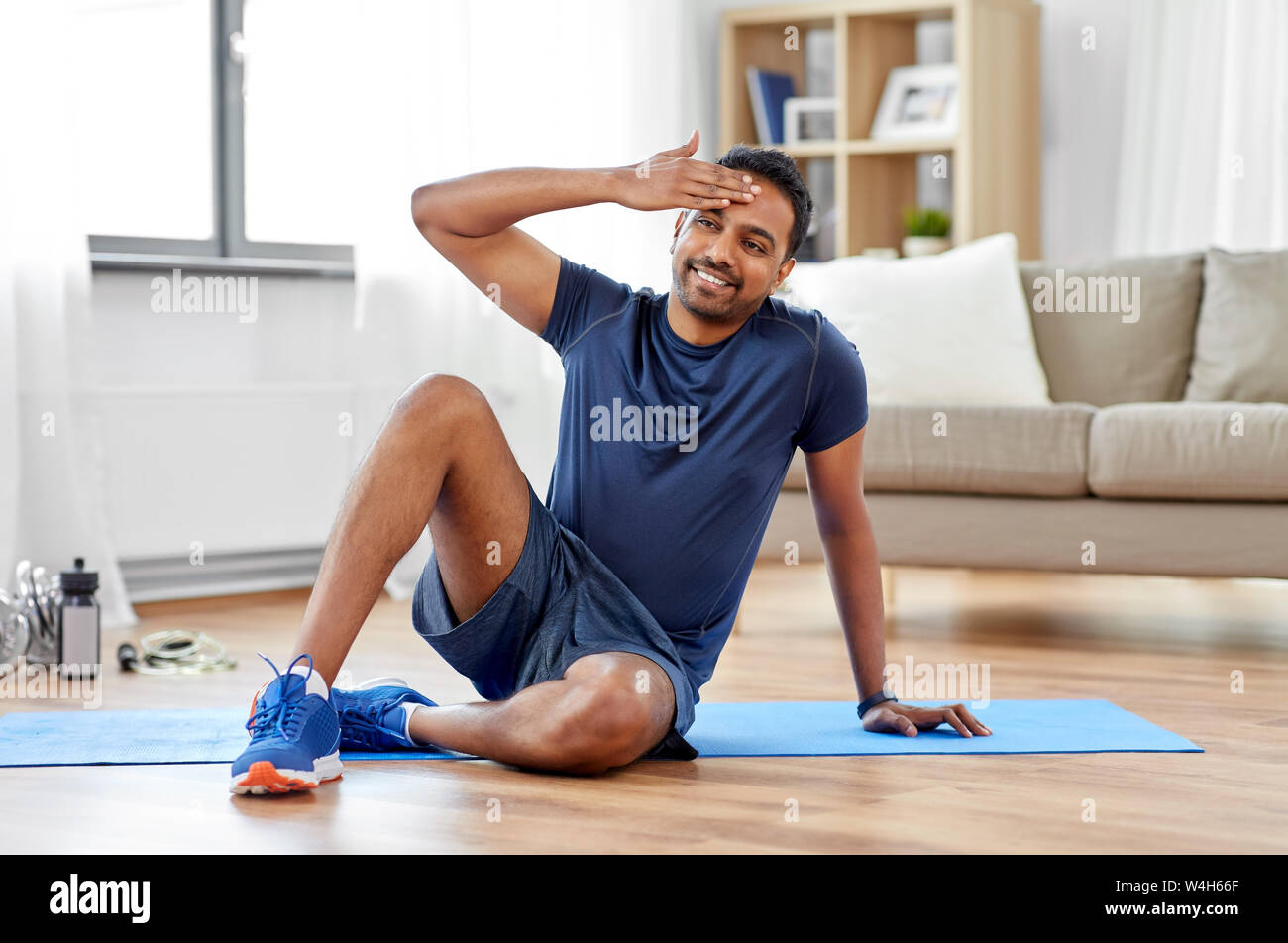 tired indian man after training at home Stock Photo - Alamy