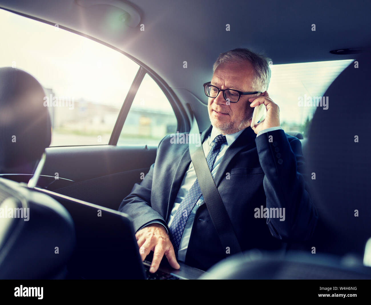 senior businessman calling on smartphone in car Stock Photo - Alamy