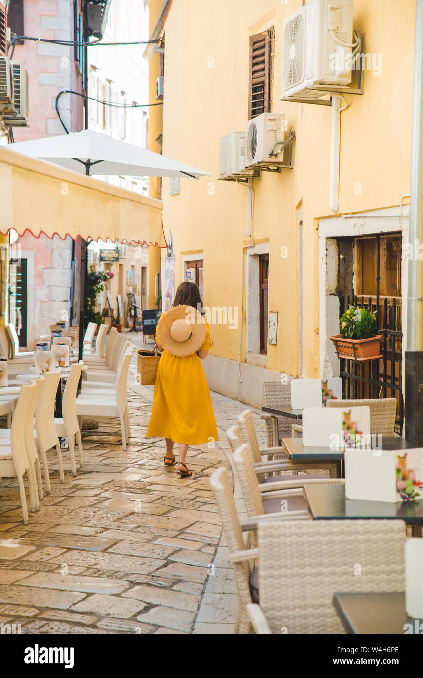 Woman walking between restaurant tables hi-res stock photography and ...