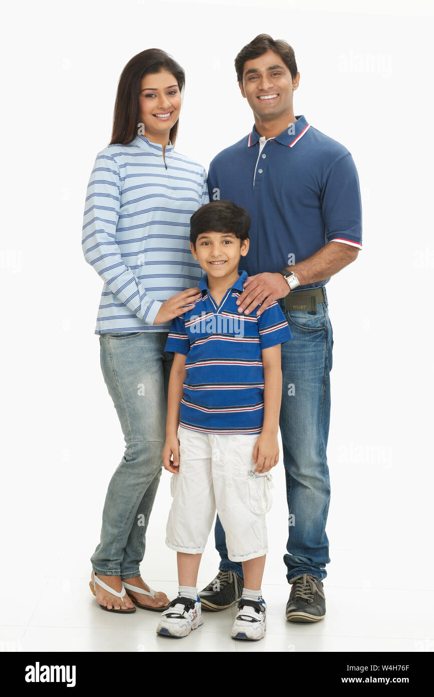 Family standing together and smiling Stock Photo - Alamy