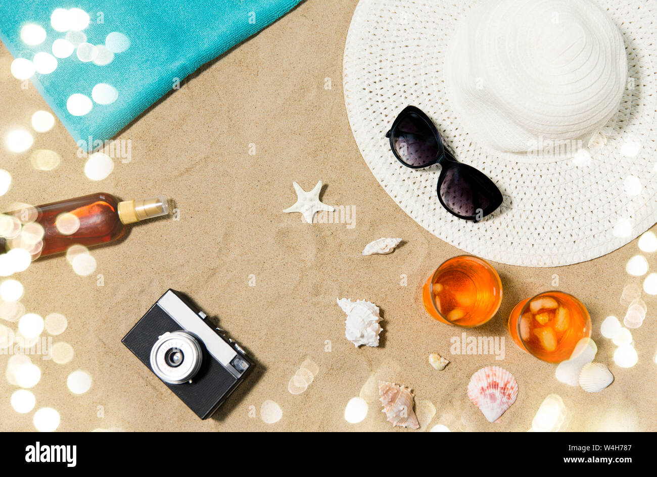 drinks, hat, camera and sunglasses on beach sand Stock Photo - Alamy