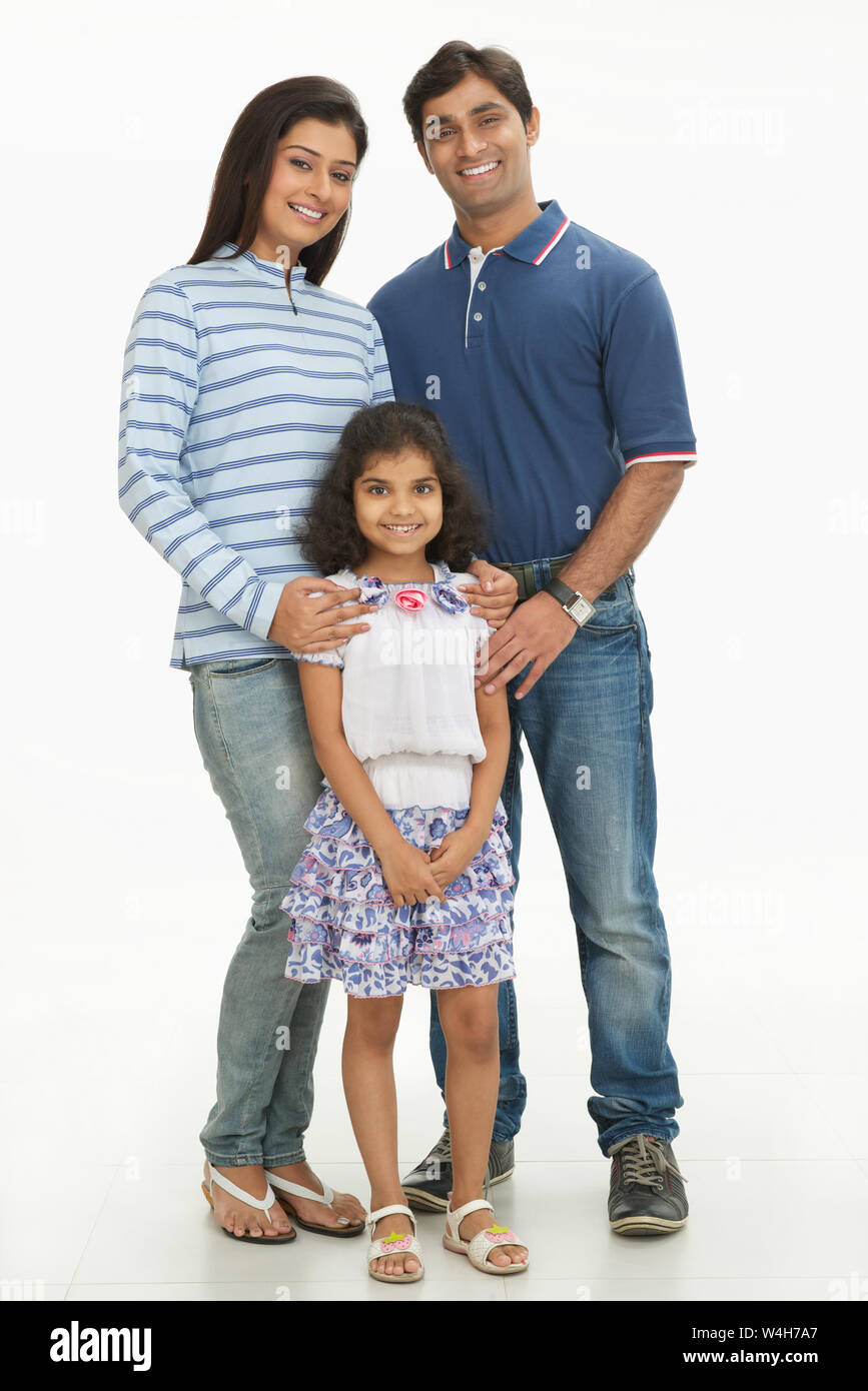 Family standing together and smiling Stock Photo - Alamy