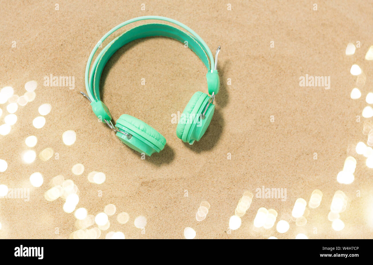 earphones on summer beach sand Stock Photo - Alamy