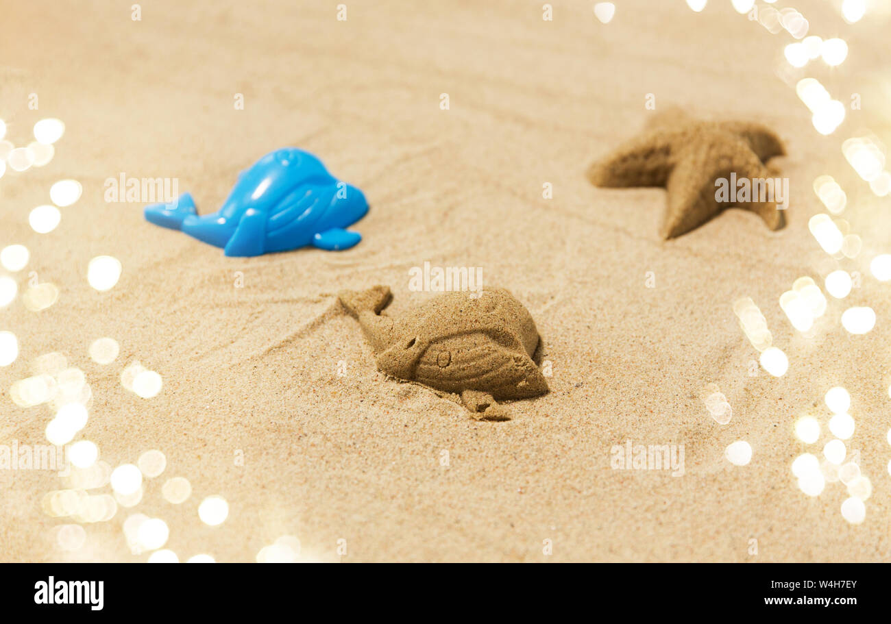 sand shape made by whale mold on summer beach Stock Photo - Alamy