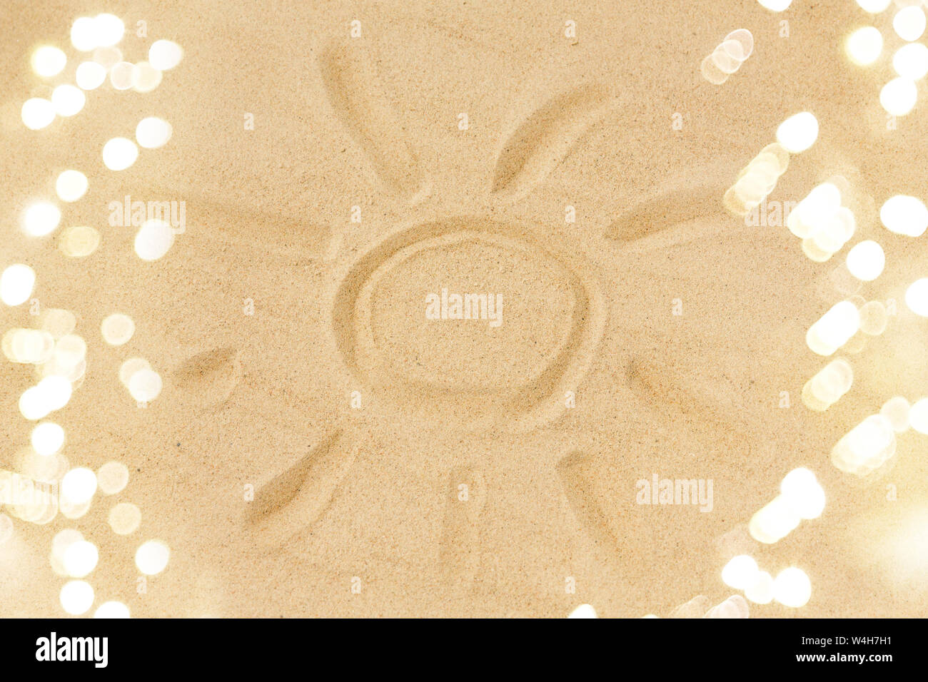 picture of sun in sand on summer beach Stock Photo - Alamy