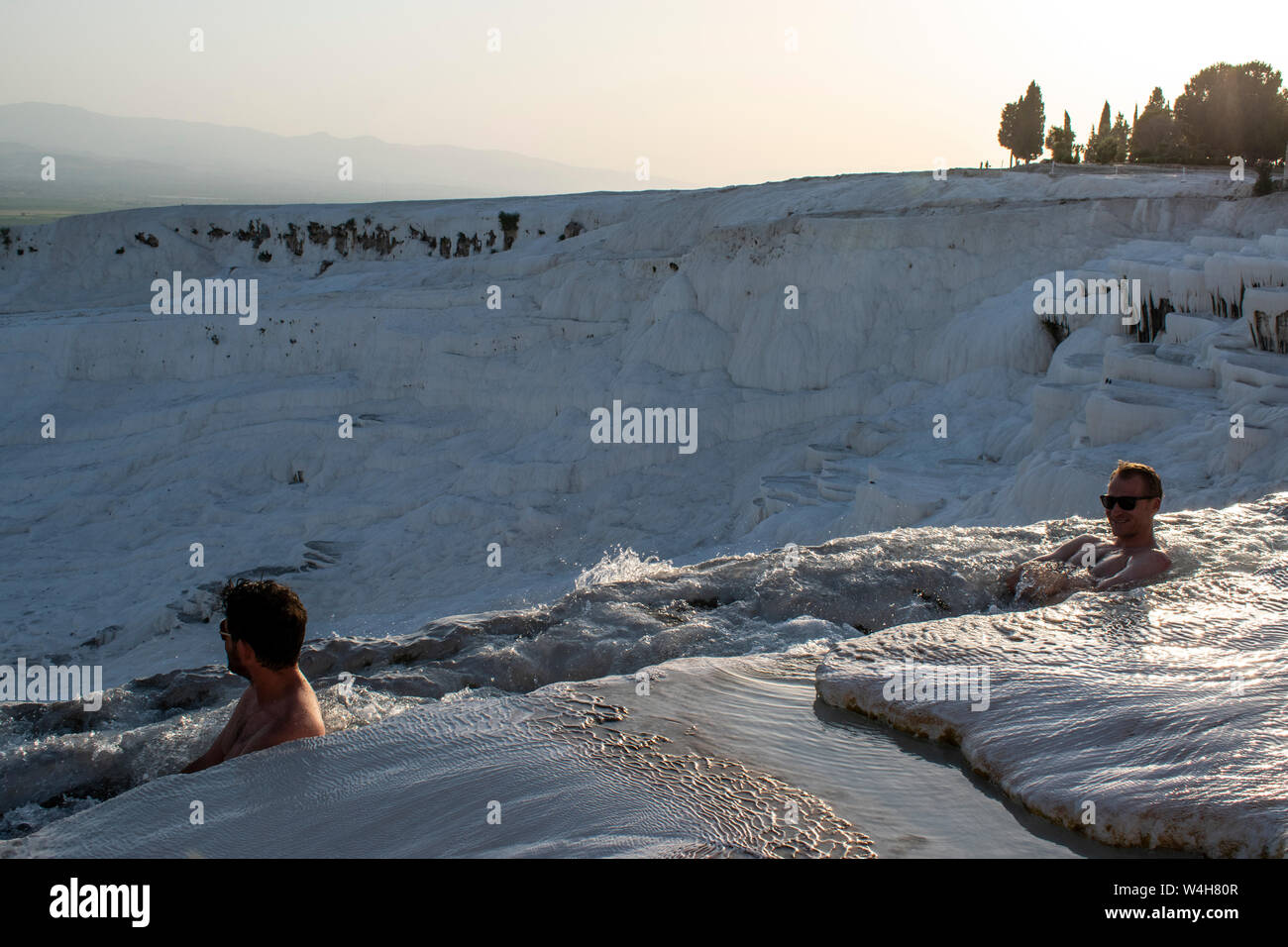 Turkey: men enjoying the flowing water from the hot springs on the ...