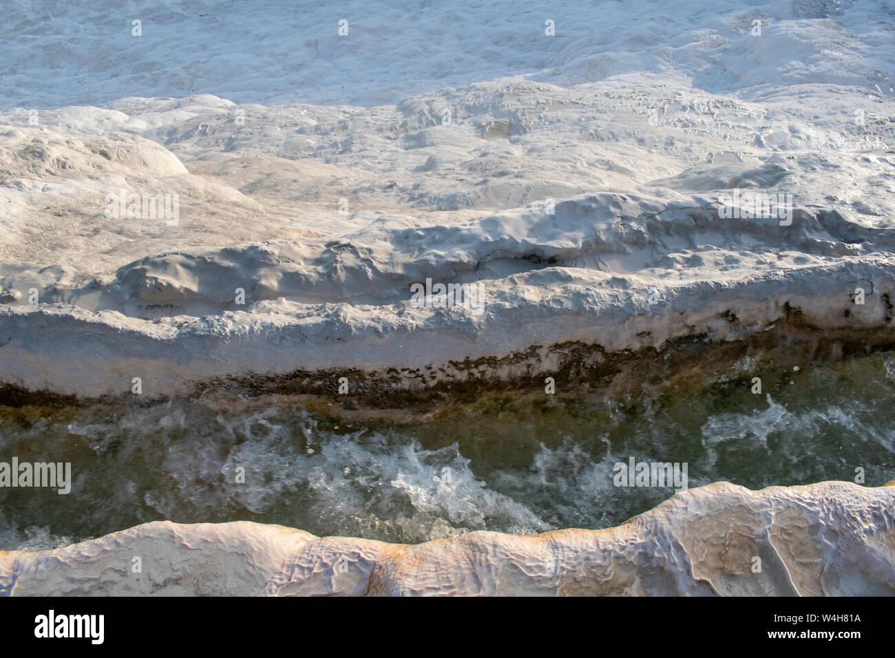 Turkey: flowing water from hot springs on the travertine terraces at ...