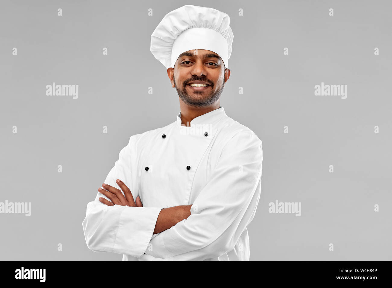 happy male indian chef in toque Stock Photo - Alamy