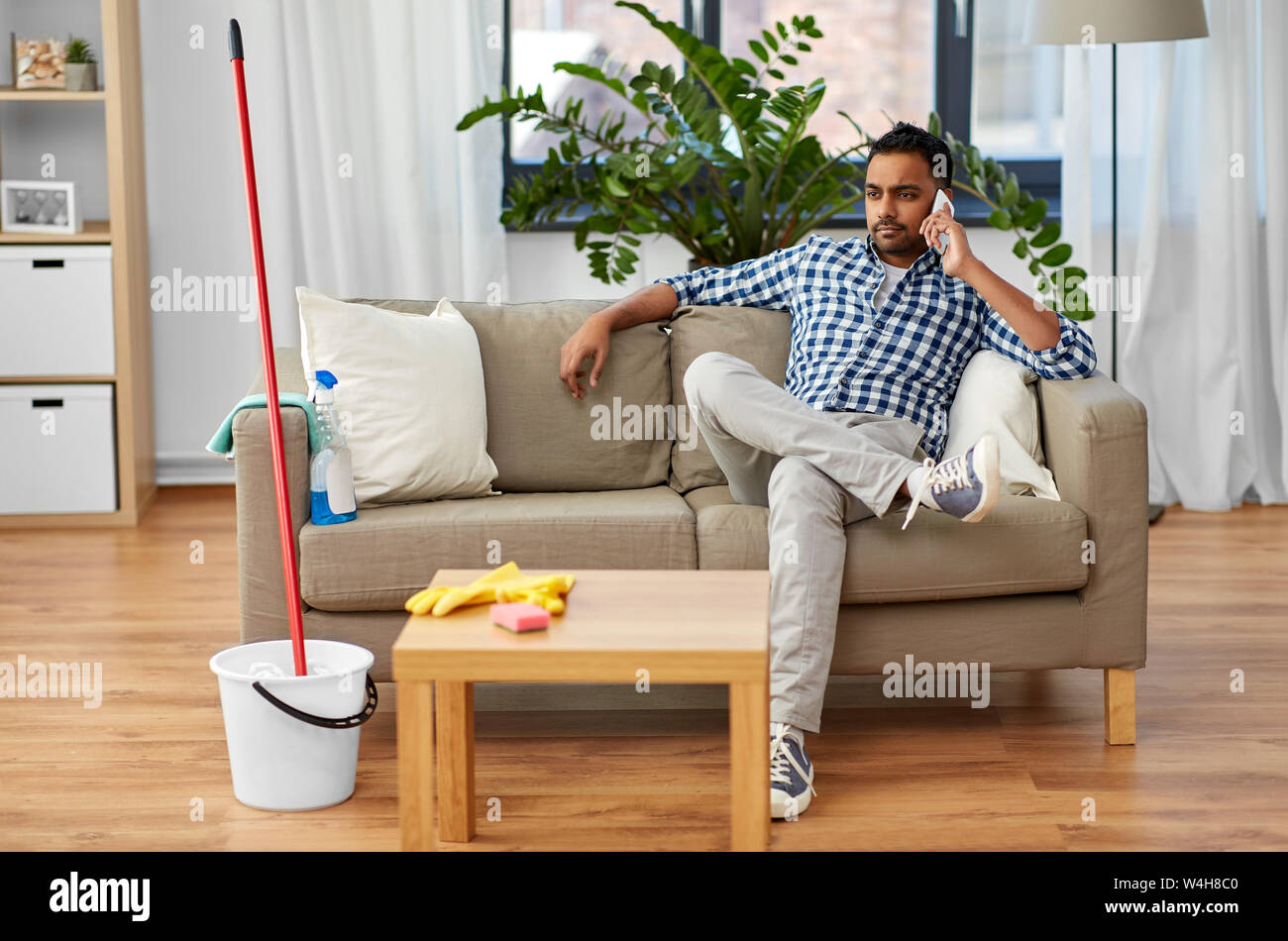 Man talking on phone cleaning hi-res stock photography and images - Alamy
