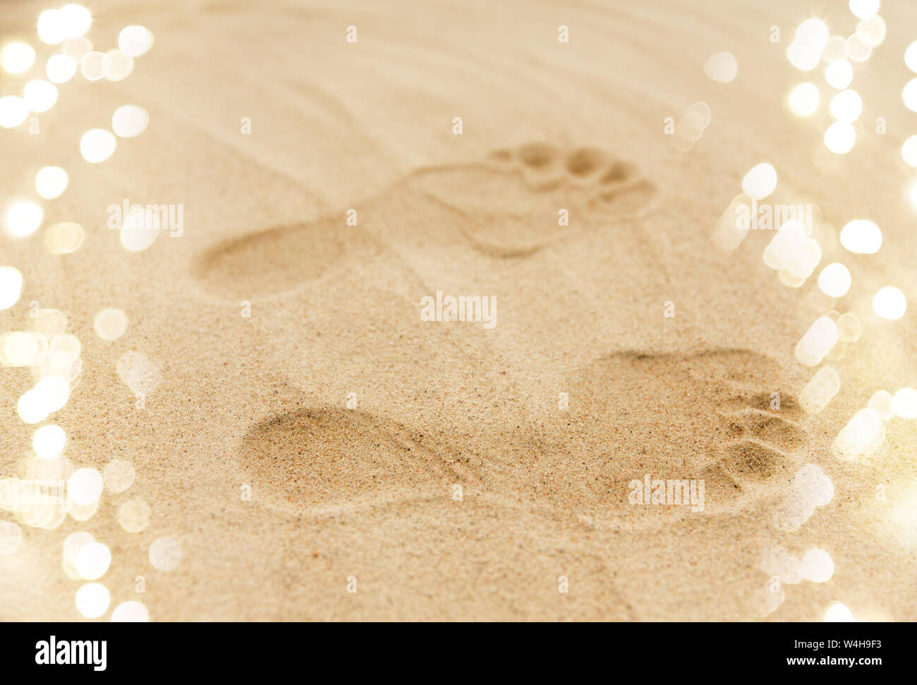 footprints in sand on summer beach Stock Photo - Alamy