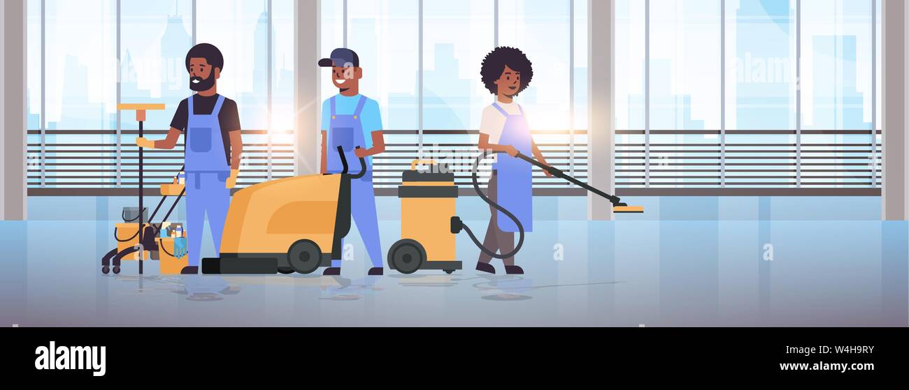 cleaners team in uniform working together cleaning service concept ...