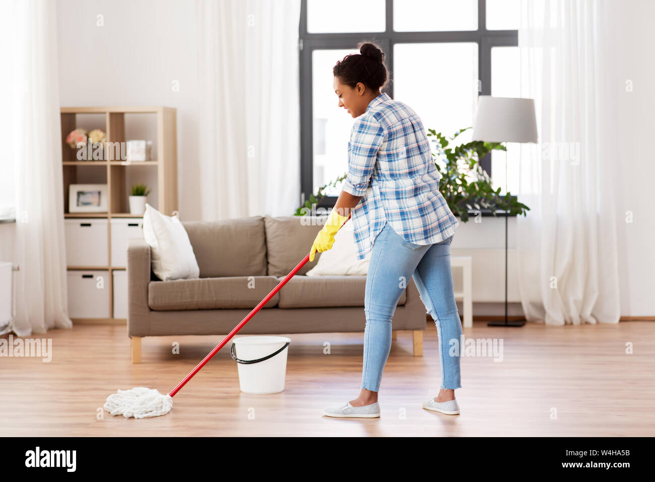 african woman or housewife cleaning floor at home Stock Photo - Alamy