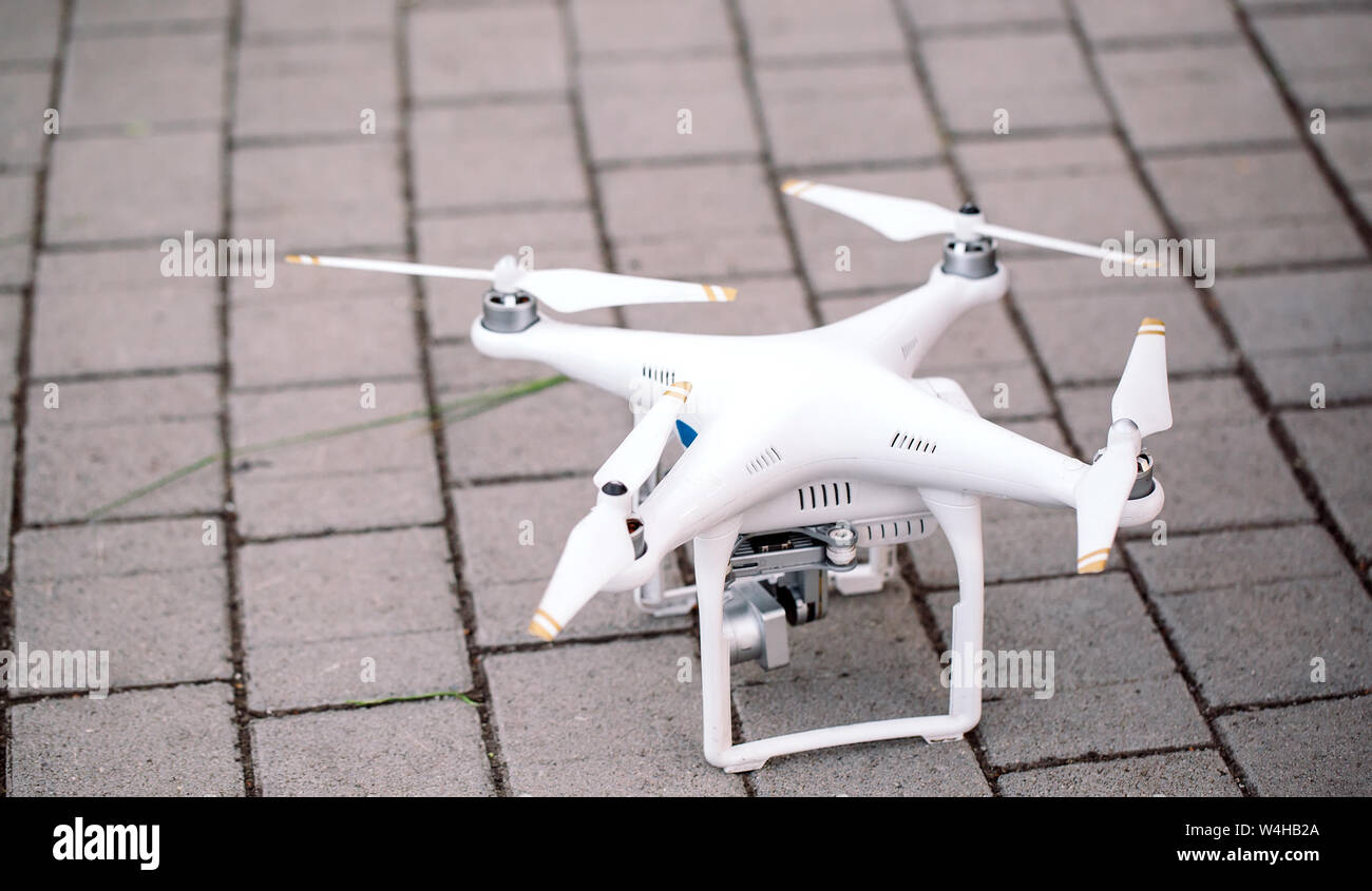Drone with camera preparing to fly over the lake Stock Photo - Alamy