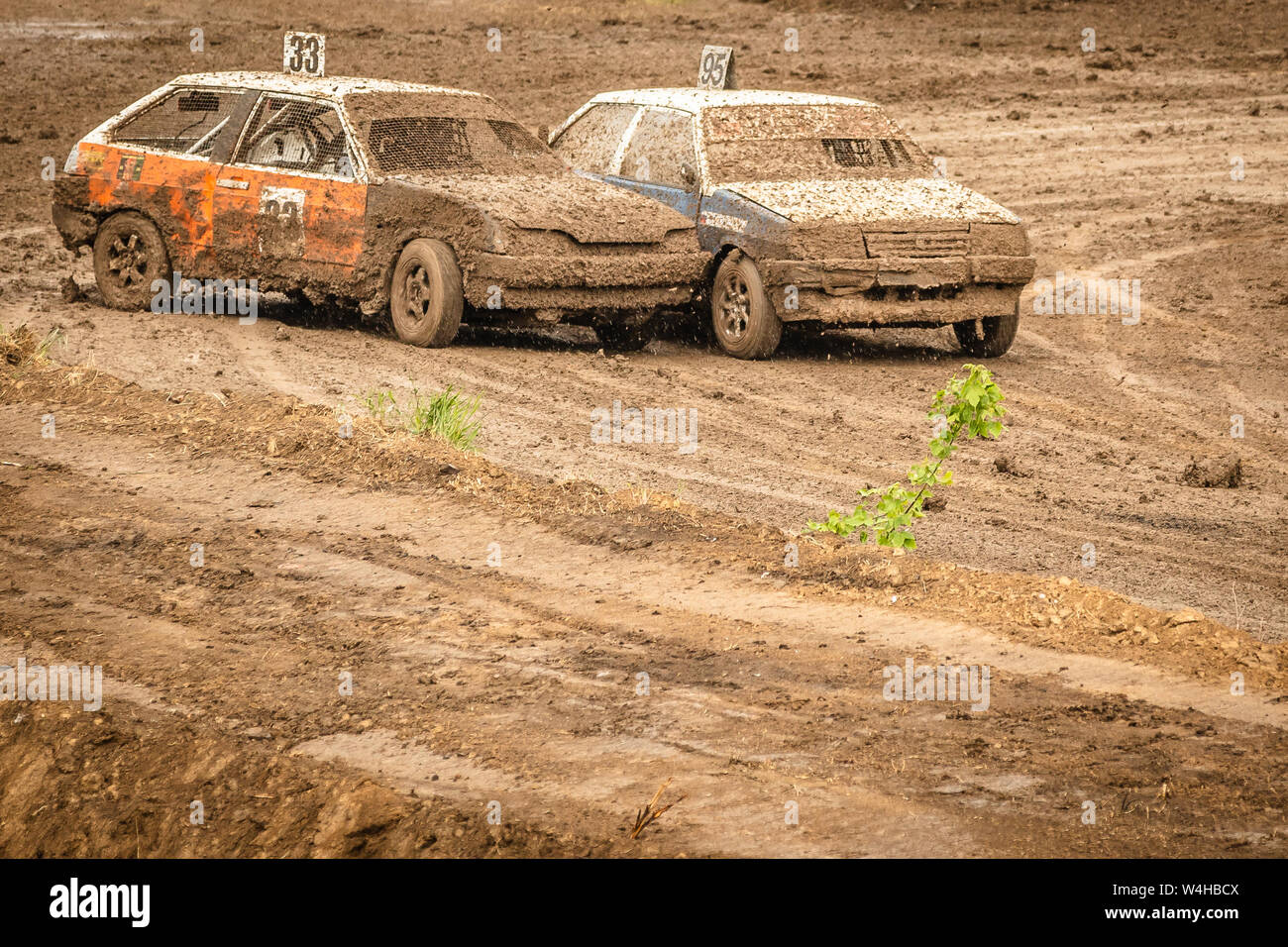 Traditional rally .The racing car drives into a steep turn, scattering ...