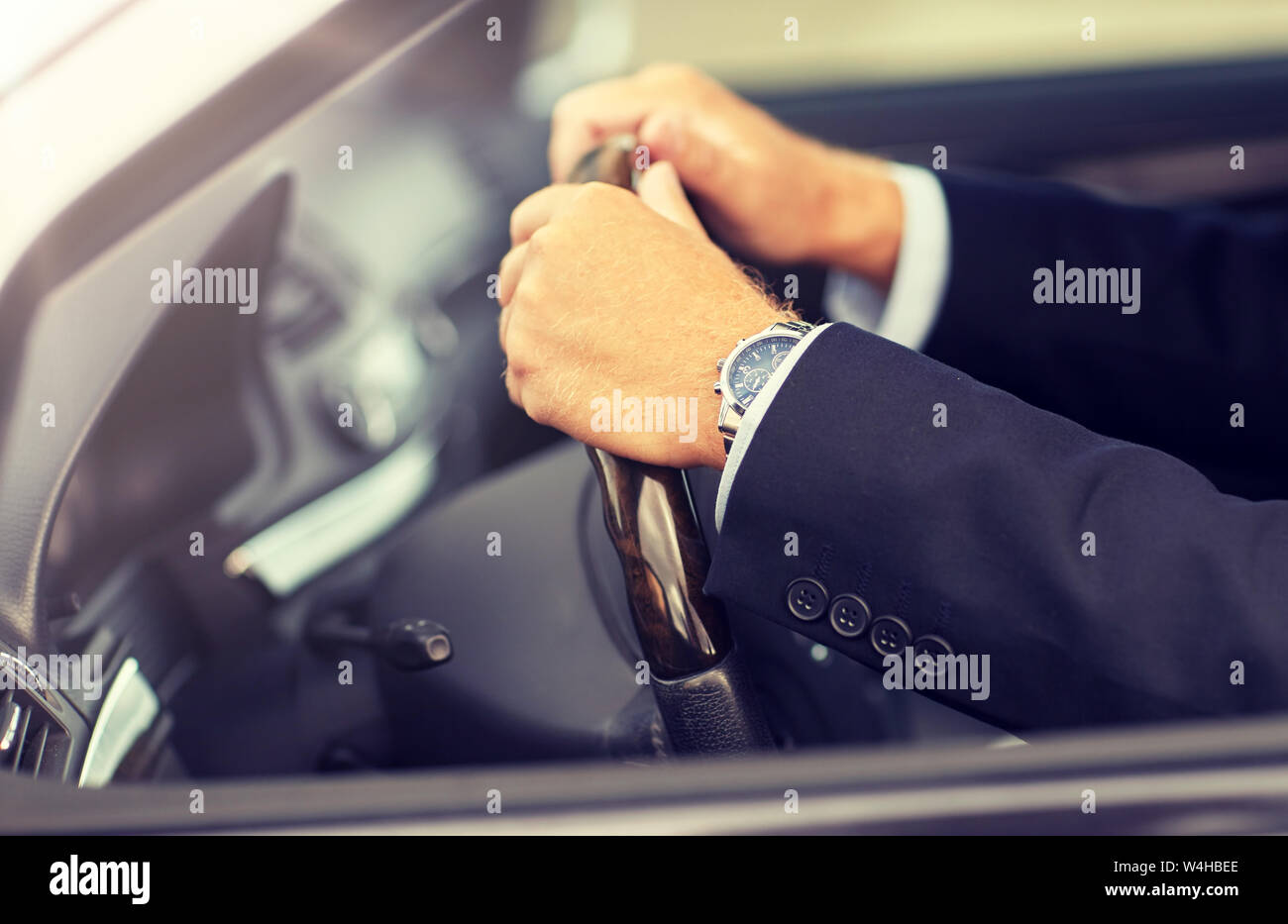 senior businessman hands driving car Stock Photo - Alamy