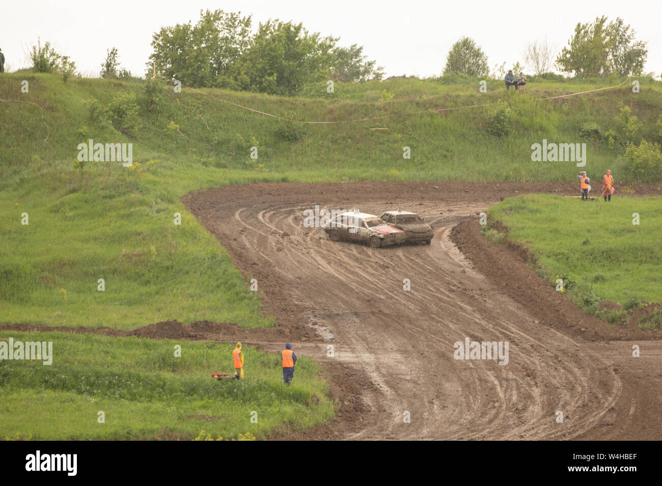 Traditional rally .The racing car drives into a steep turn, scattering ...