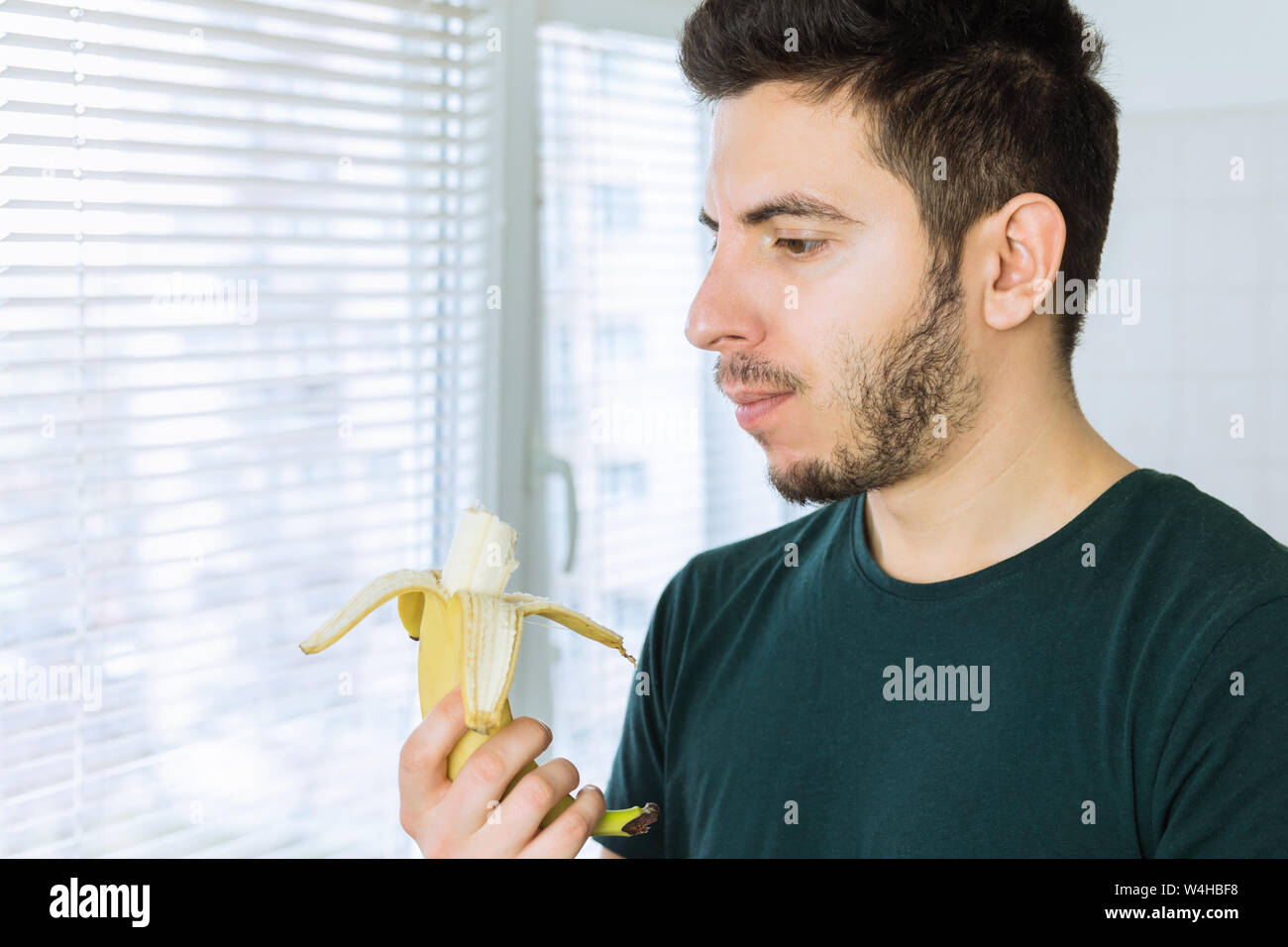 Bite off banana hi-res stock photography and images - Alamy
