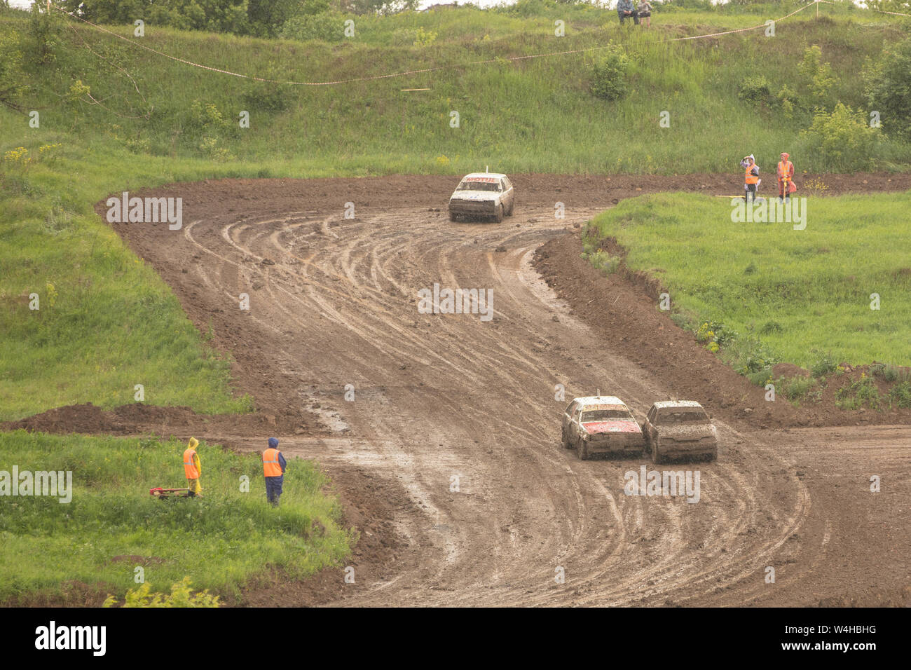 Traditional rally .The racing car drives into a steep turn, scattering ...