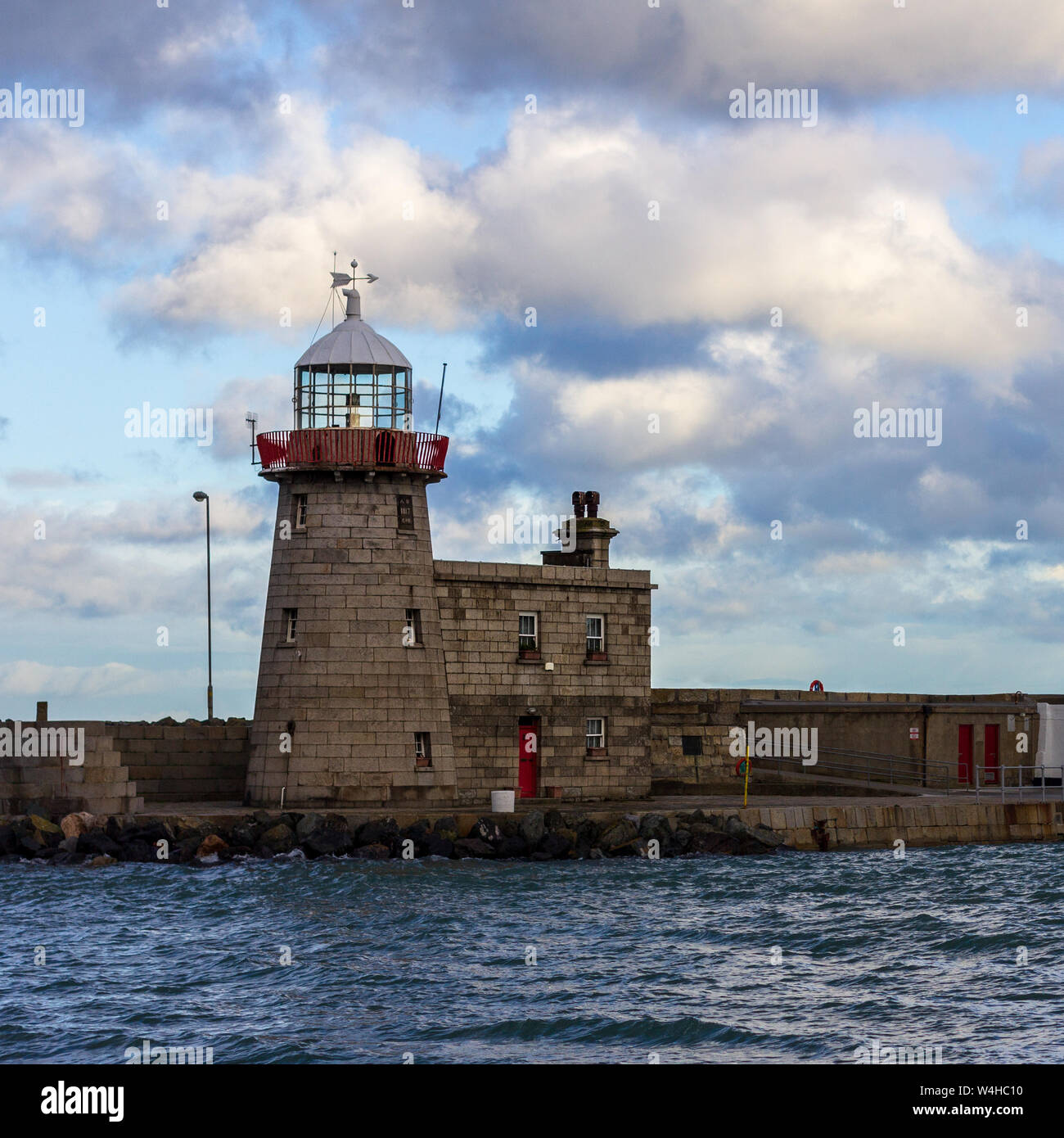 Howth Lighthouse is located at the entrance to the harbor in Howth ...