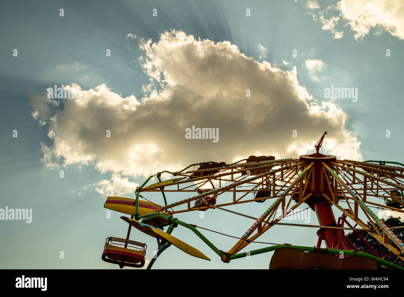 Ride in amusement park on sky background Stock Photo - Alamy