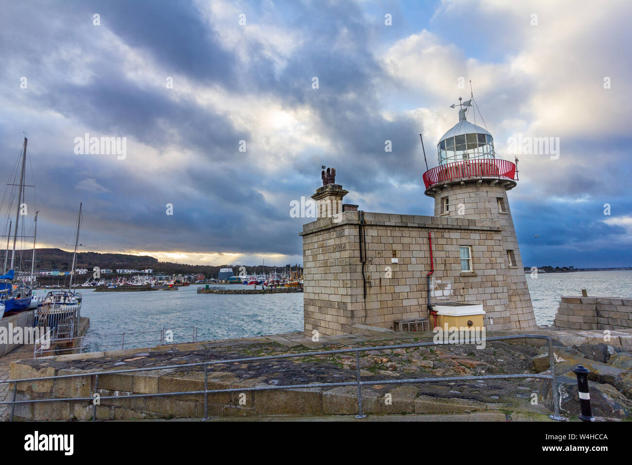 Howth Lighthouse is located at the entrance to the harbor in Howth ...