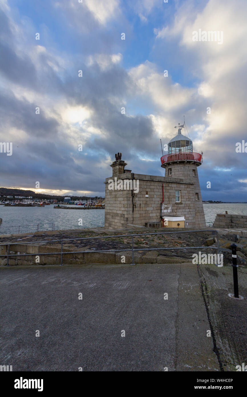 Howth Lighthouse is located at the entrance to the harbor in Howth ...